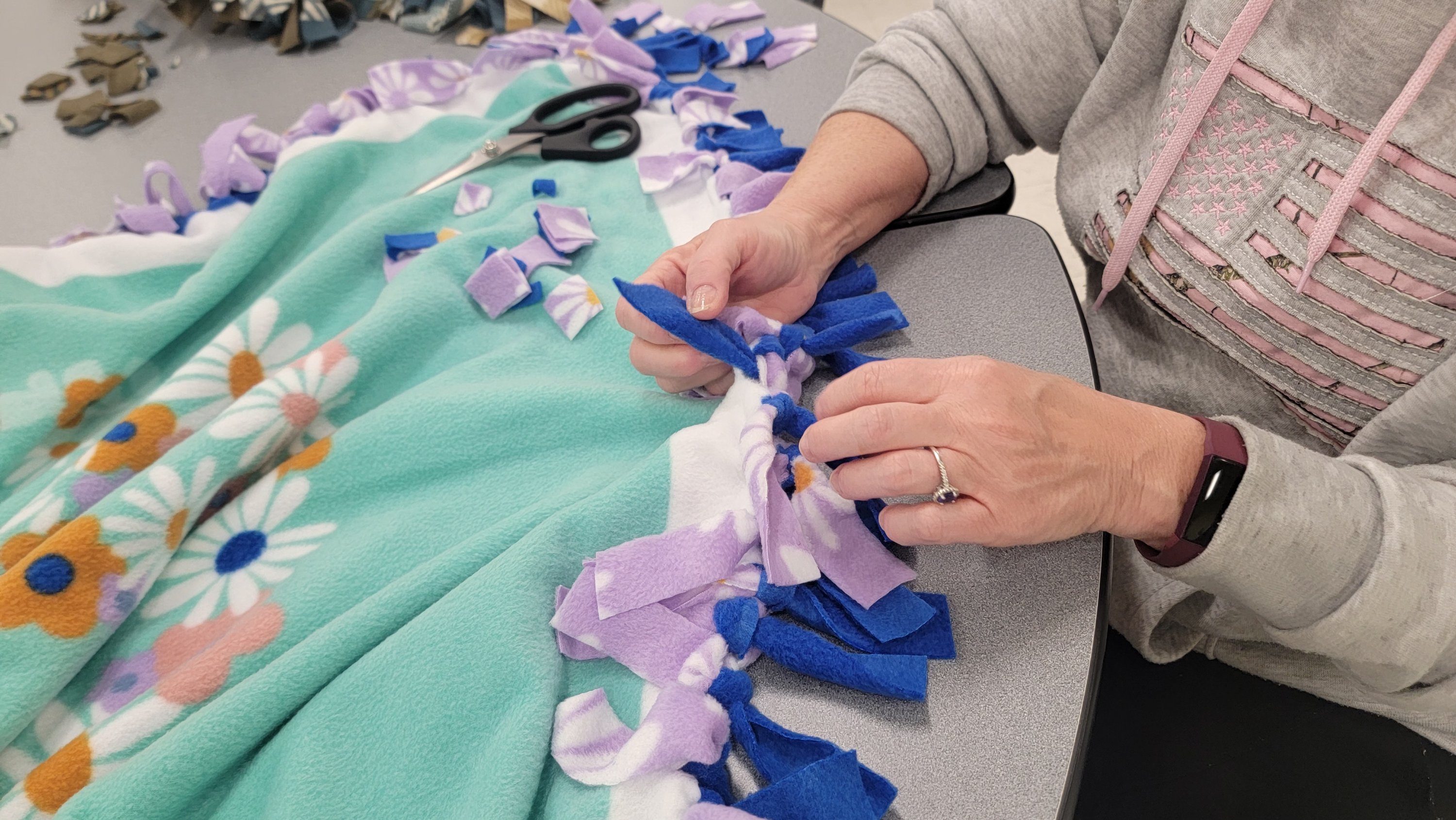 Practicing Kindness: Volunteers make blankets for those in need ...